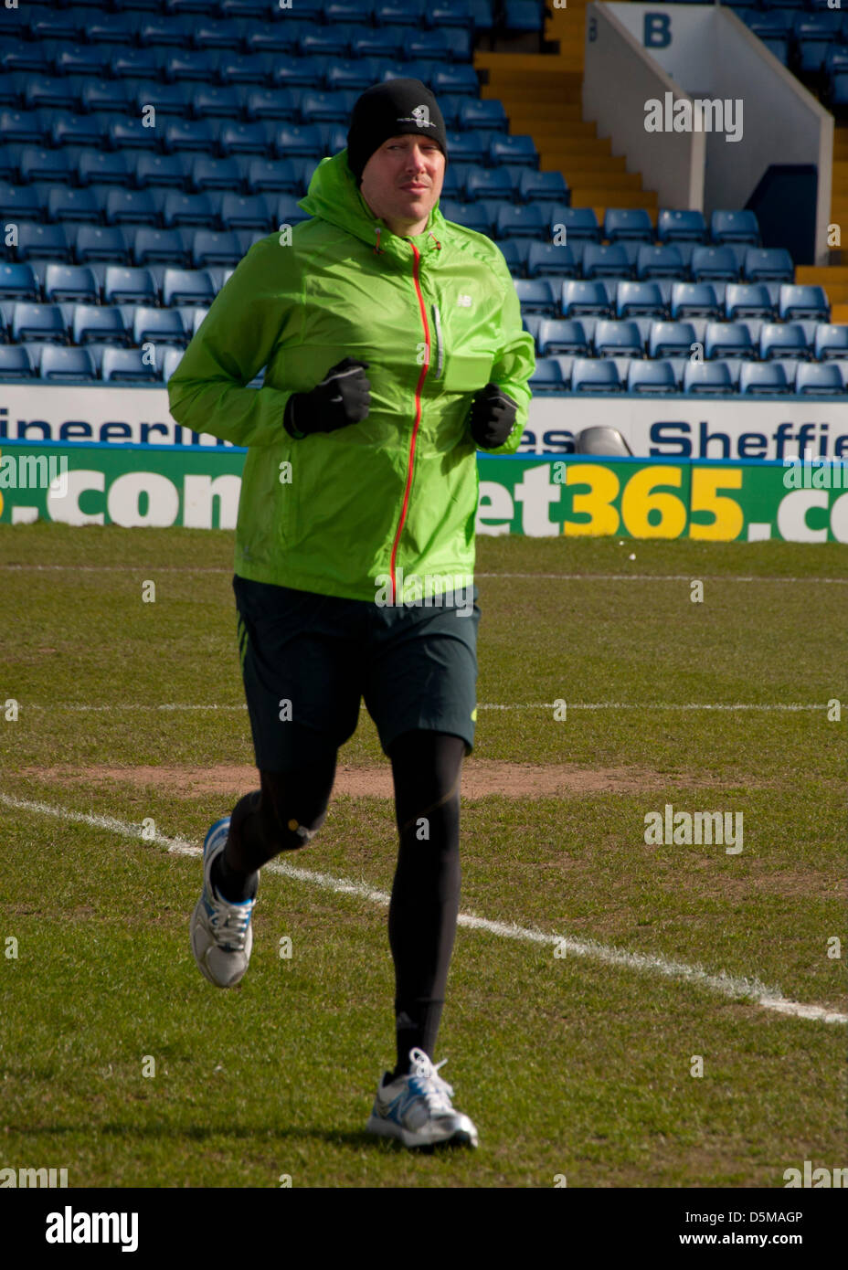 Sheffield, UK. 4th April 2013. Runner, Neil Mitchell, limbers up before ...