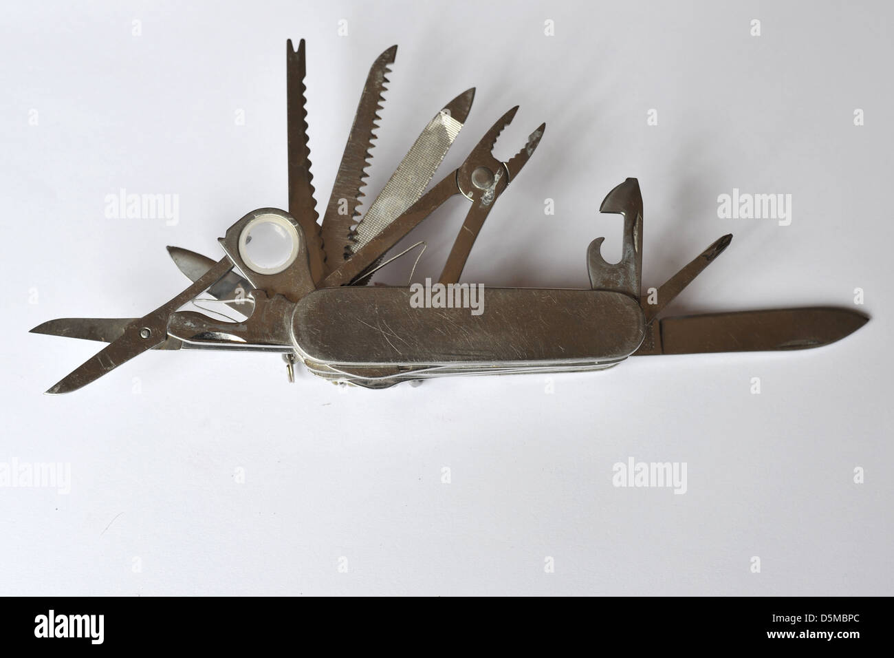 A large multi tool penknife with all its tools extended Stock Photo - Alamy