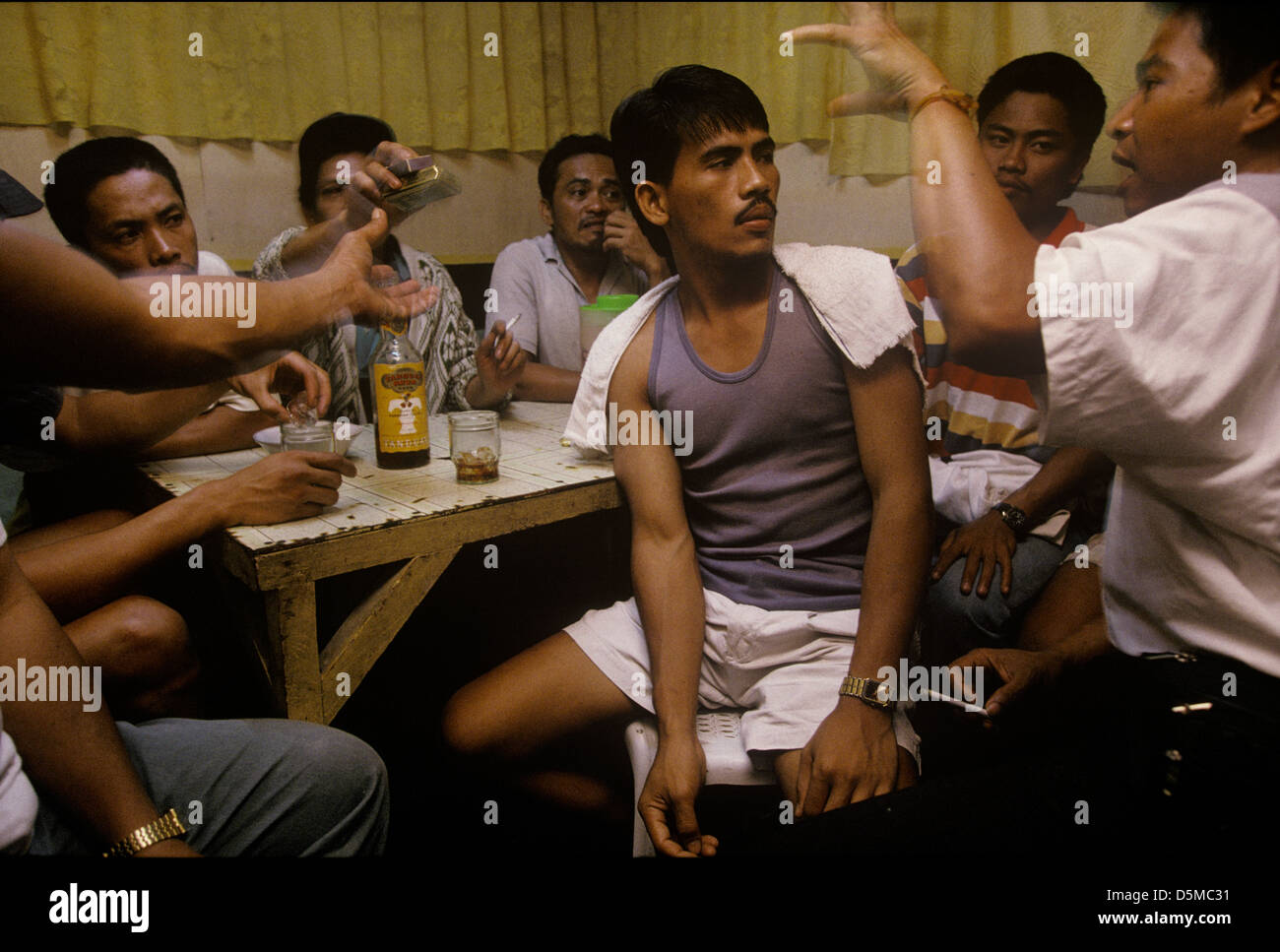 Miners drinking in a bar in the mining community on Mount Diwata ...
