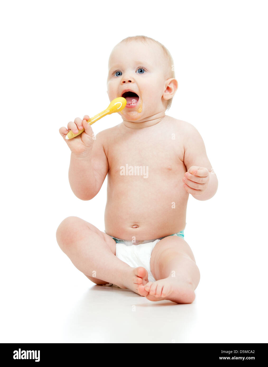 Little baby feeding with a spoon Stock Photo - Alamy