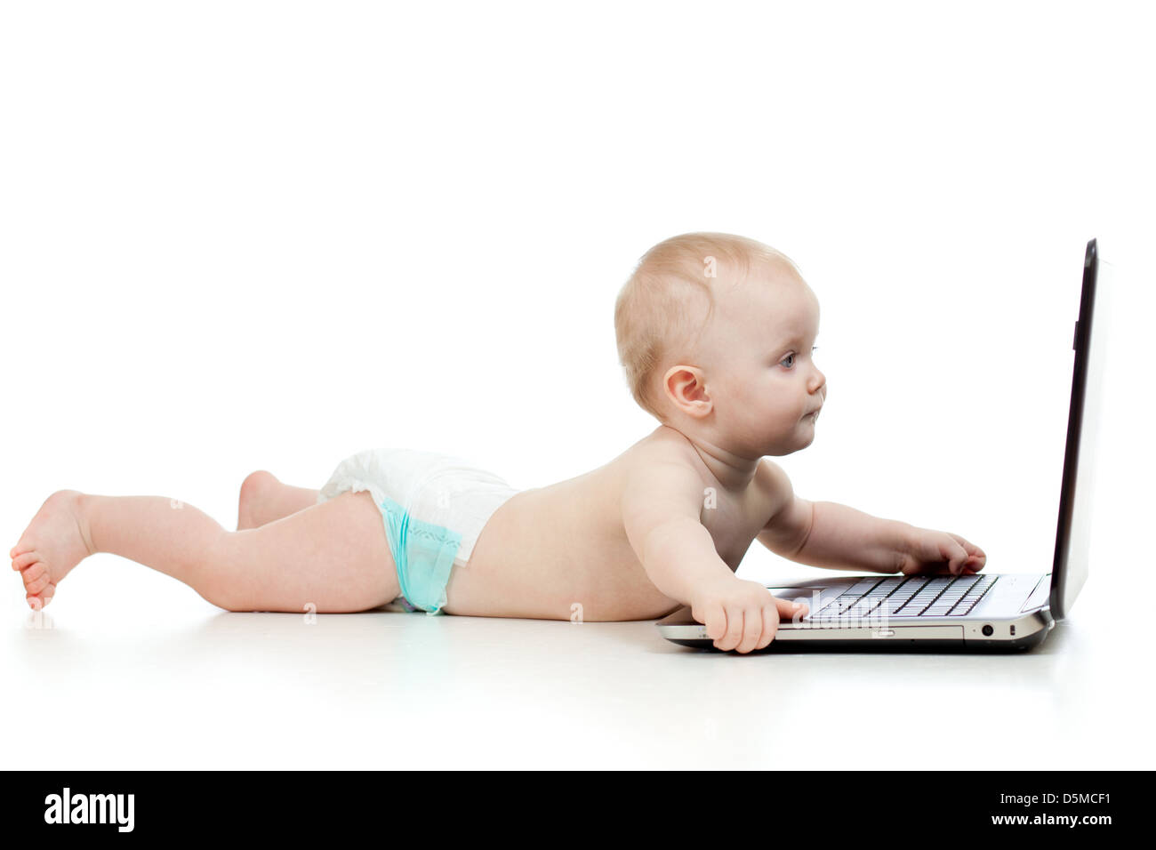 Child using a laptop Stock Photo - Alamy