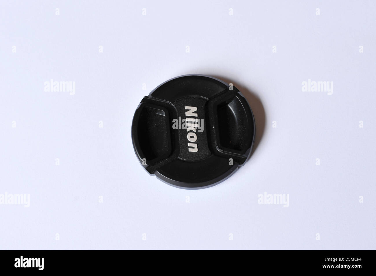 The front lens cap for a Nikon lens Stock Photo - Alamy