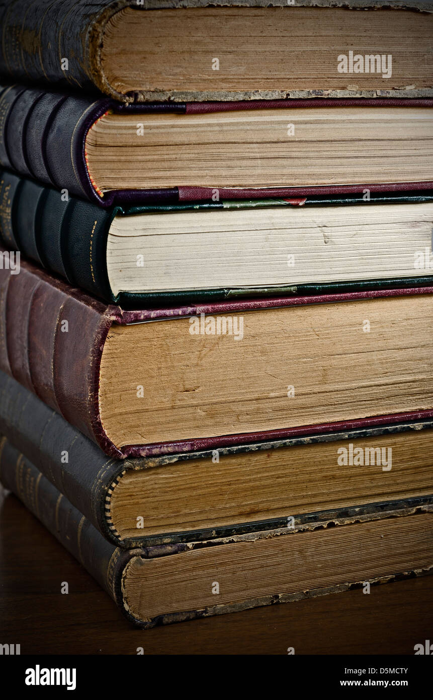 Stack of old books in low key Stock Photo - Alamy