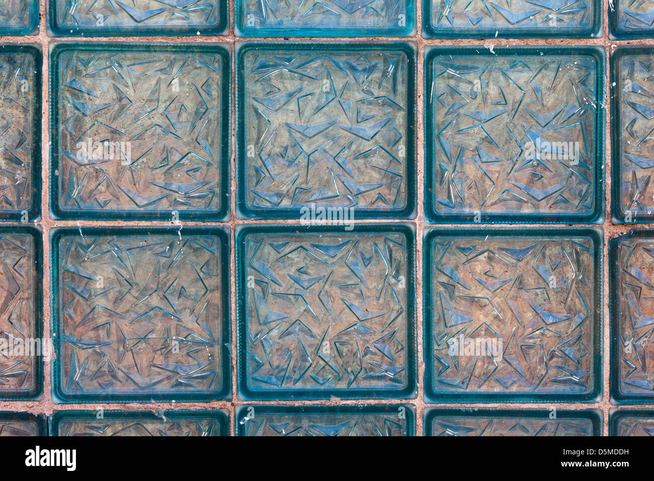 Old grunge glass block wall as background Stock Photo - Alamy