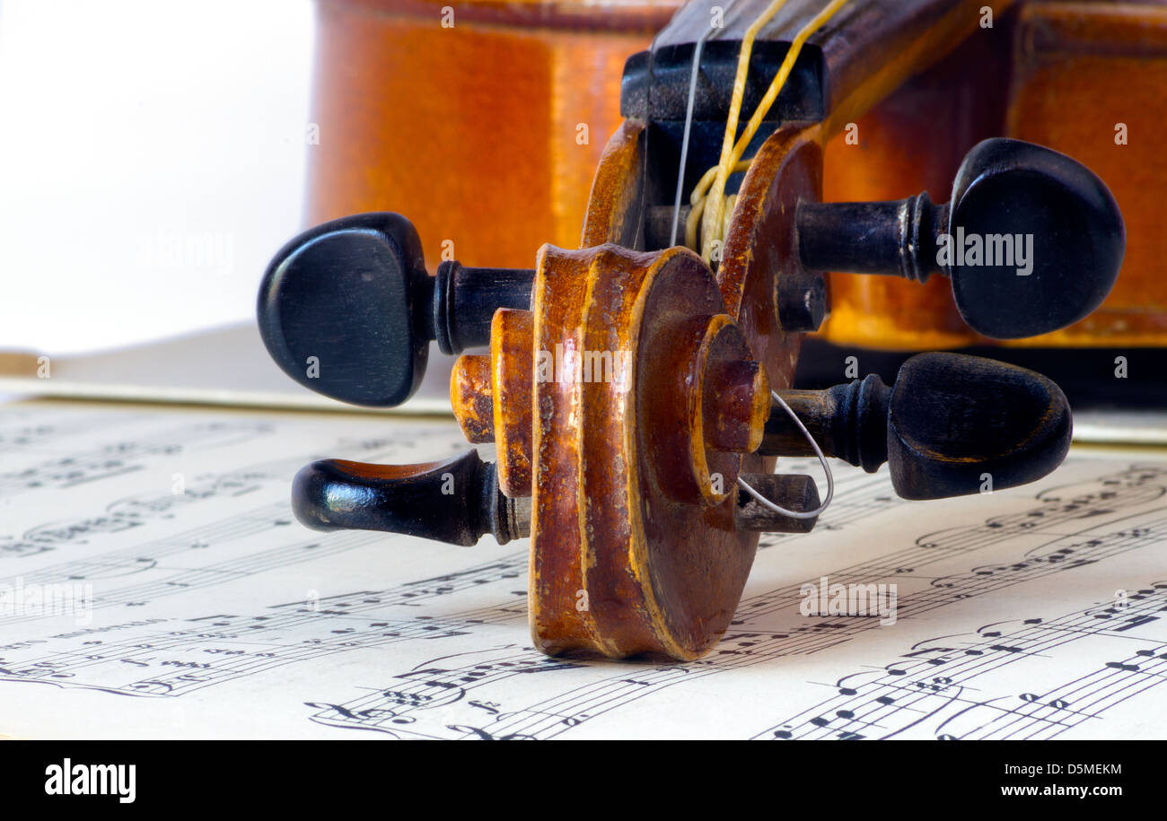 Closeup of a frontal view of a violin and a music sheet Stock Photo - Alamy