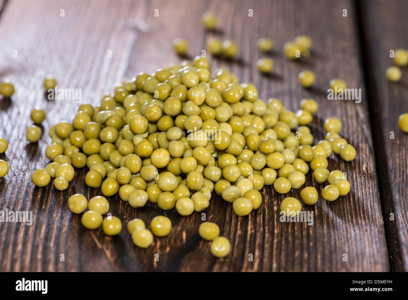 Heap of Peas on wooden background Stock Photo - Alamy
