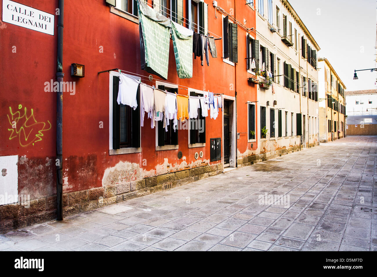 Drying clothes in front of a house Stock Photo - Alamy