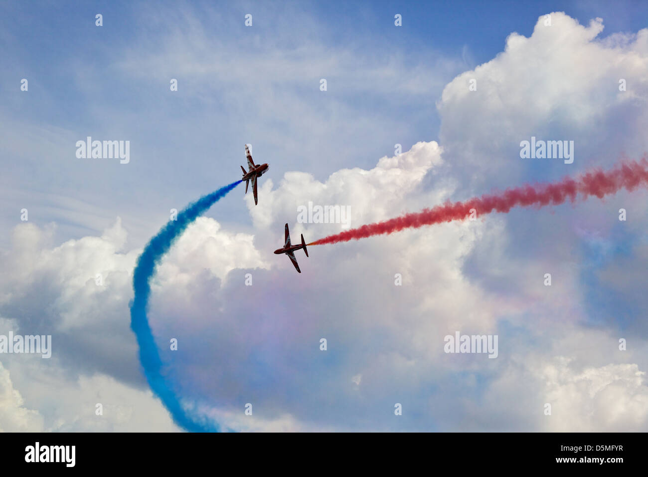 Two jets from the Red Arrows RAF aerobatics display team perform a high ...