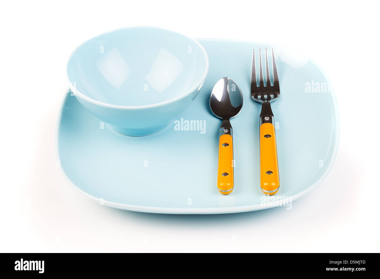 Fork, spoon and plate on white Stock Photo - Alamy