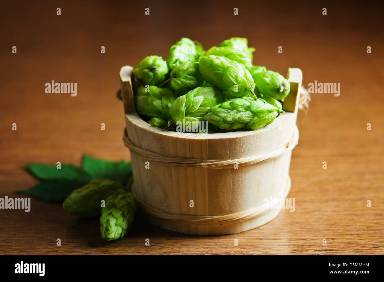 hop on wood barrel closeup Stock Photo - Alamy