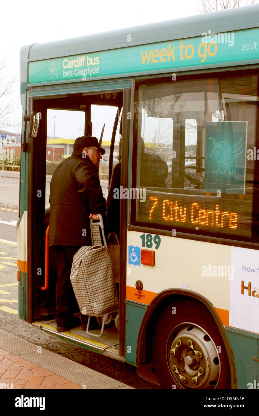 Old man climbing on to a Cardiff city bus services, April 2013 Stock ...