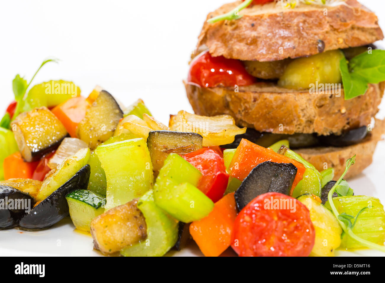 Steamed vegetables and rye bread on white background Stock Photo - Alamy