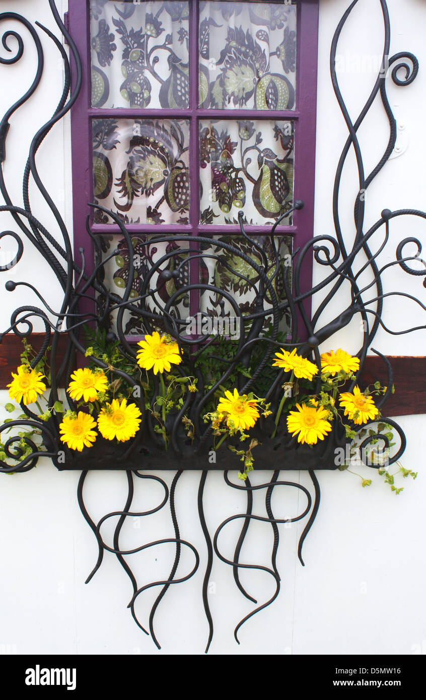 Decorative window with flowers Stock Photo - Alamy