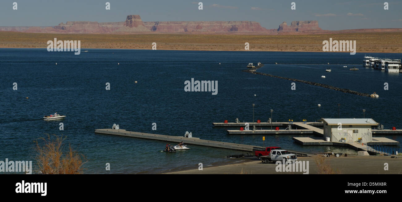 Blue sky view, to Tower Butte, across dark blue waters Lake Powell from ...