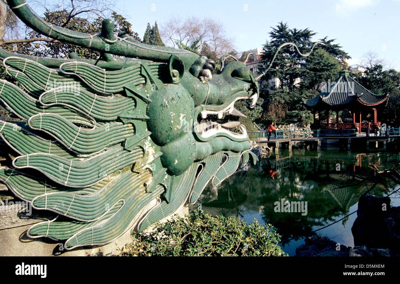 dragon looks over pond in shanghai suburb Stock Photo - Alamy