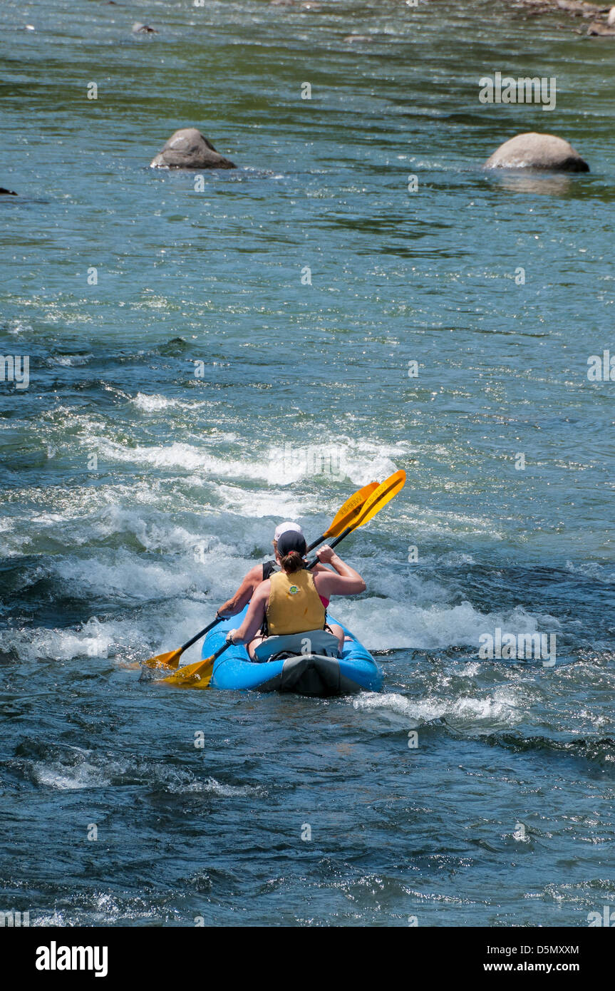 Two women and a child ride a ducky down the Animas River, Durango ...