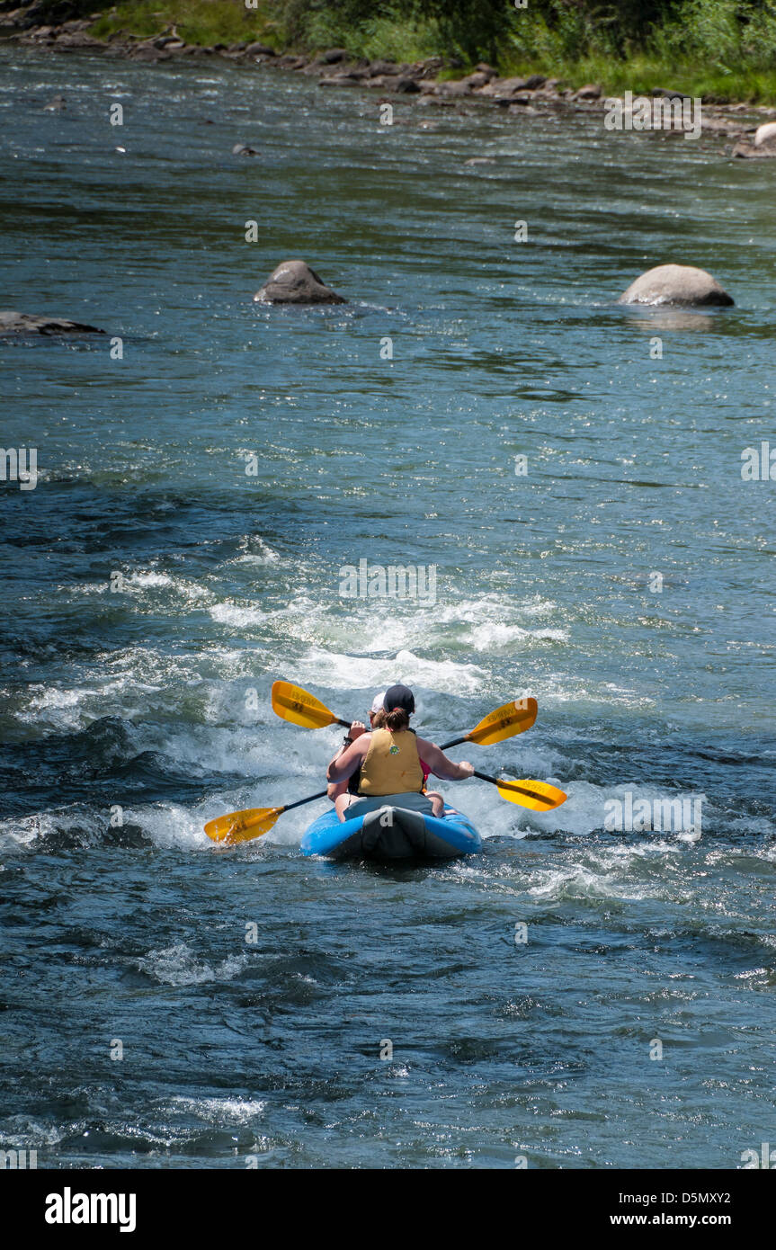 Two women and a child ride a ducky down the Animas River, Durango ...