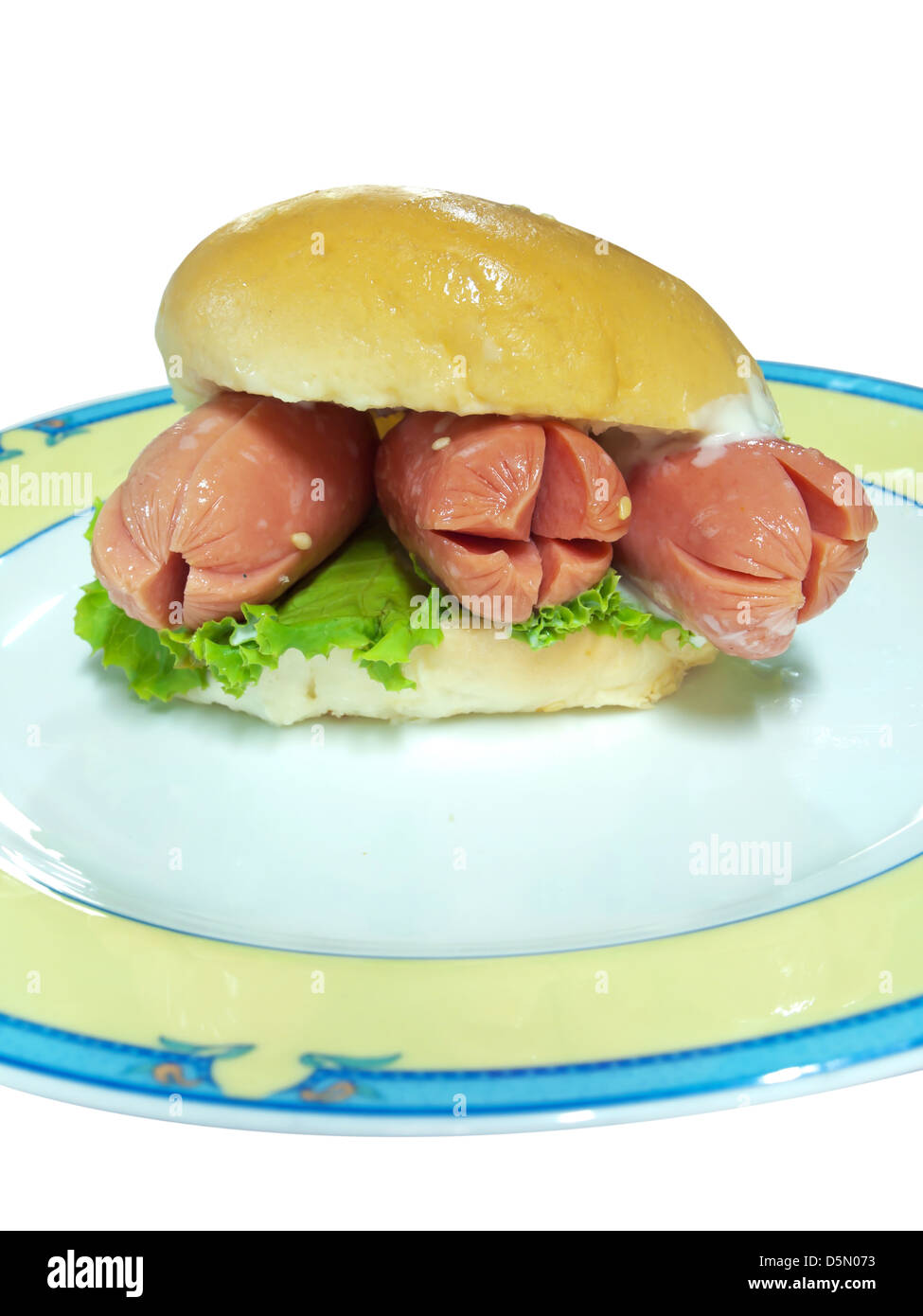Hot dog in hamburger bread Stock Photo - Alamy