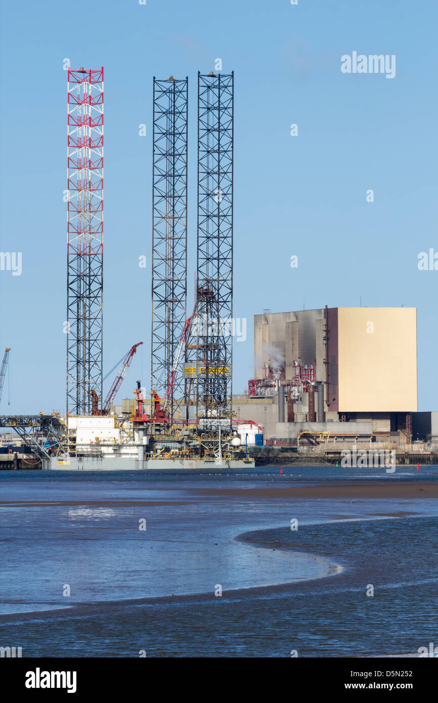 Jack up drilling rig at Greatham Creek next to Hartlepool nuclear power ...