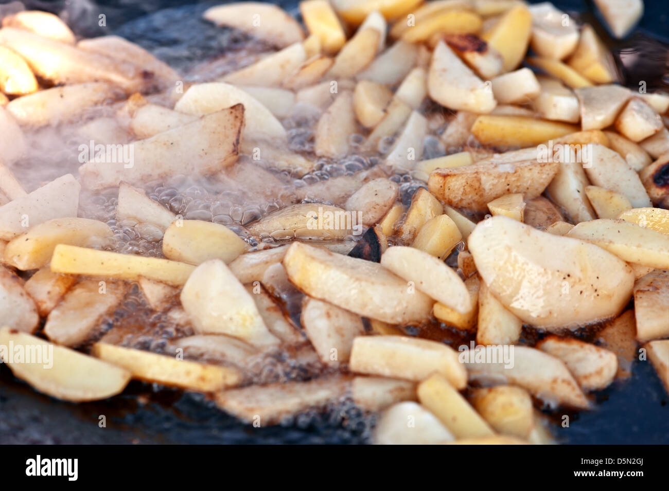 Raw potatoes fried in oil hi-res stock photography and images - Alamy