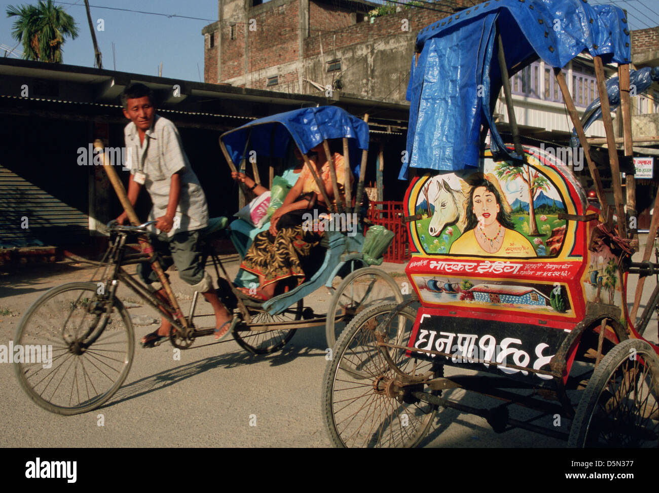 Cycle rickshaws in a street ( Nepal Stock Photo - Alamy