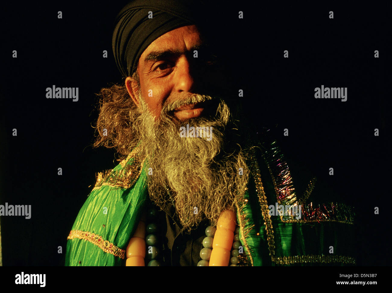 During the month of Ramadan, a muslim fakir traditionally dressed is ...