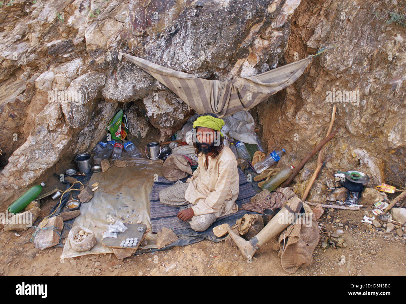 Muslim ( and amputated) beggar waiting for alms in his shelter ( India ...