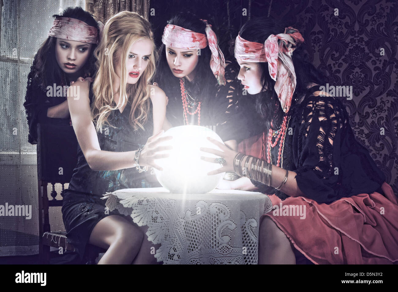 Fortune teller with her crystal ball Stock Photo - Alamy