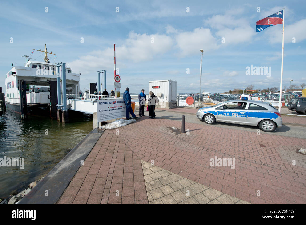 A policeman drives his car on the Hiddensee ferry in Schaprode on the ...