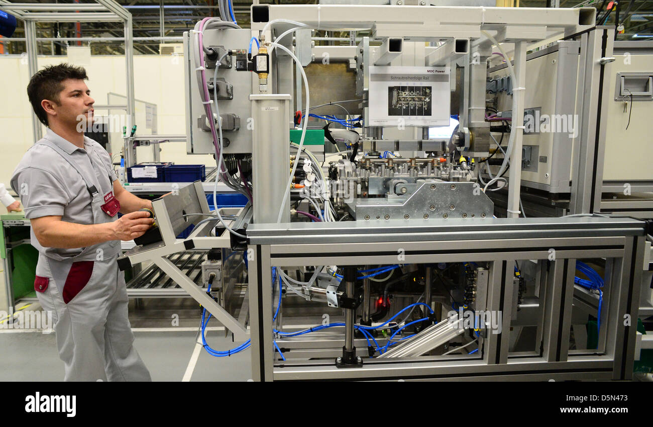 Riccardo Weber assembles a petrol engine at the engine factory of the ...