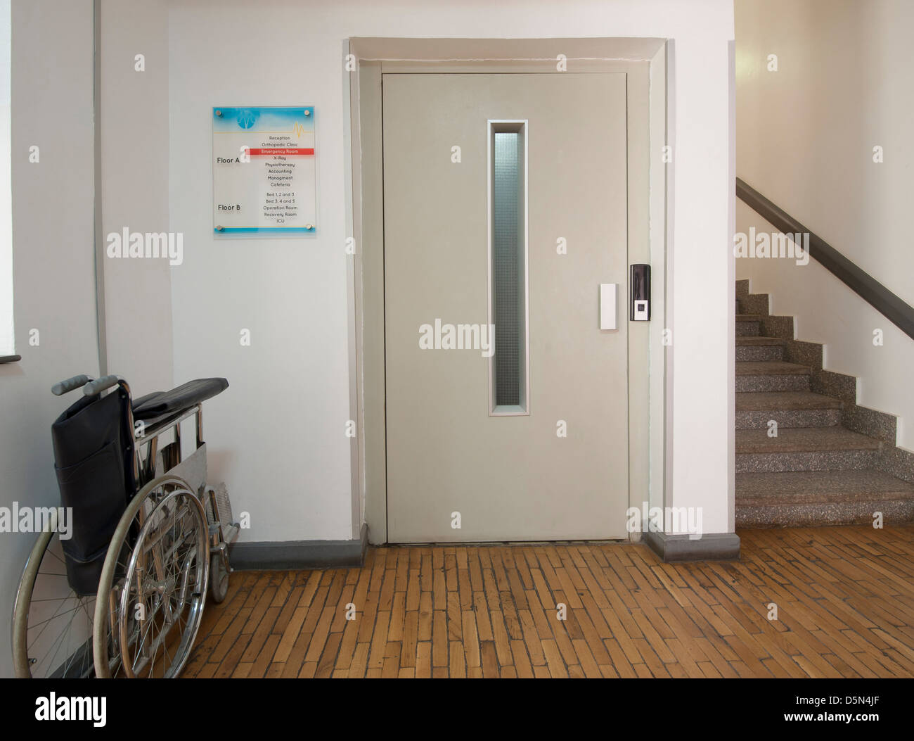 Entrance foyer in a medical centre with elevator and wheelchair Stock ...