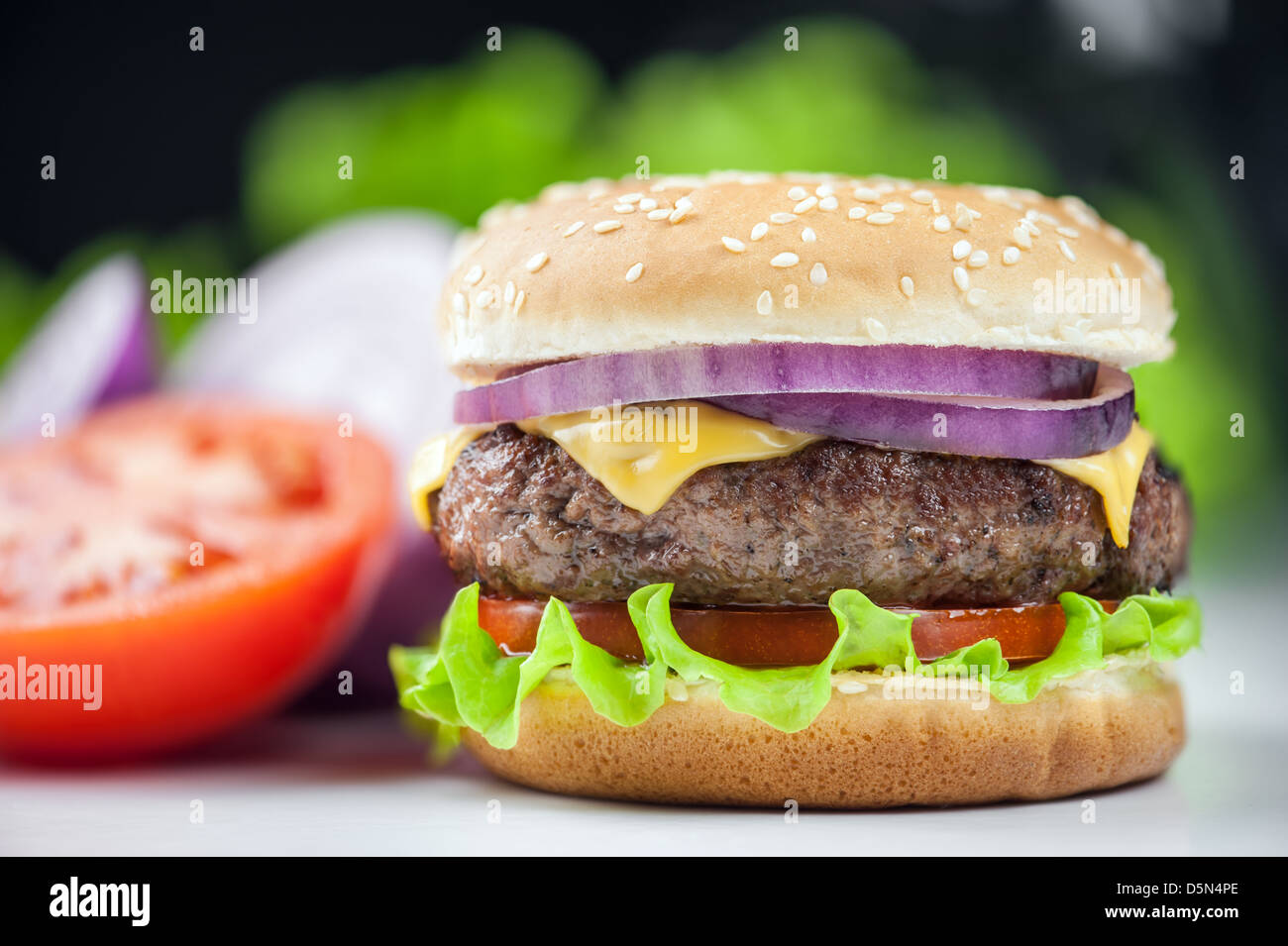 appetizing cheeseburger with red onion closeup Stock Photo - Alamy