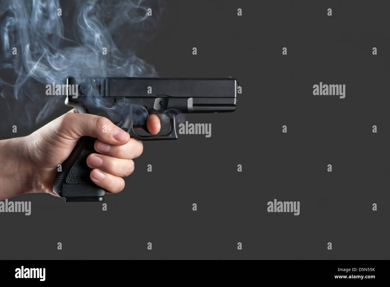 Hand gun smoke hi-res stock photography and images - Alamy