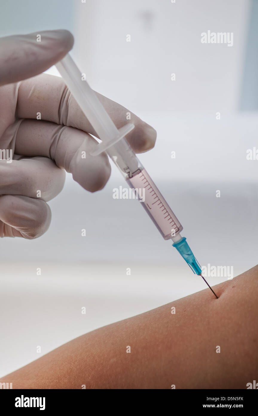 hand with syringe isolated on white Stock Photo - Alamy