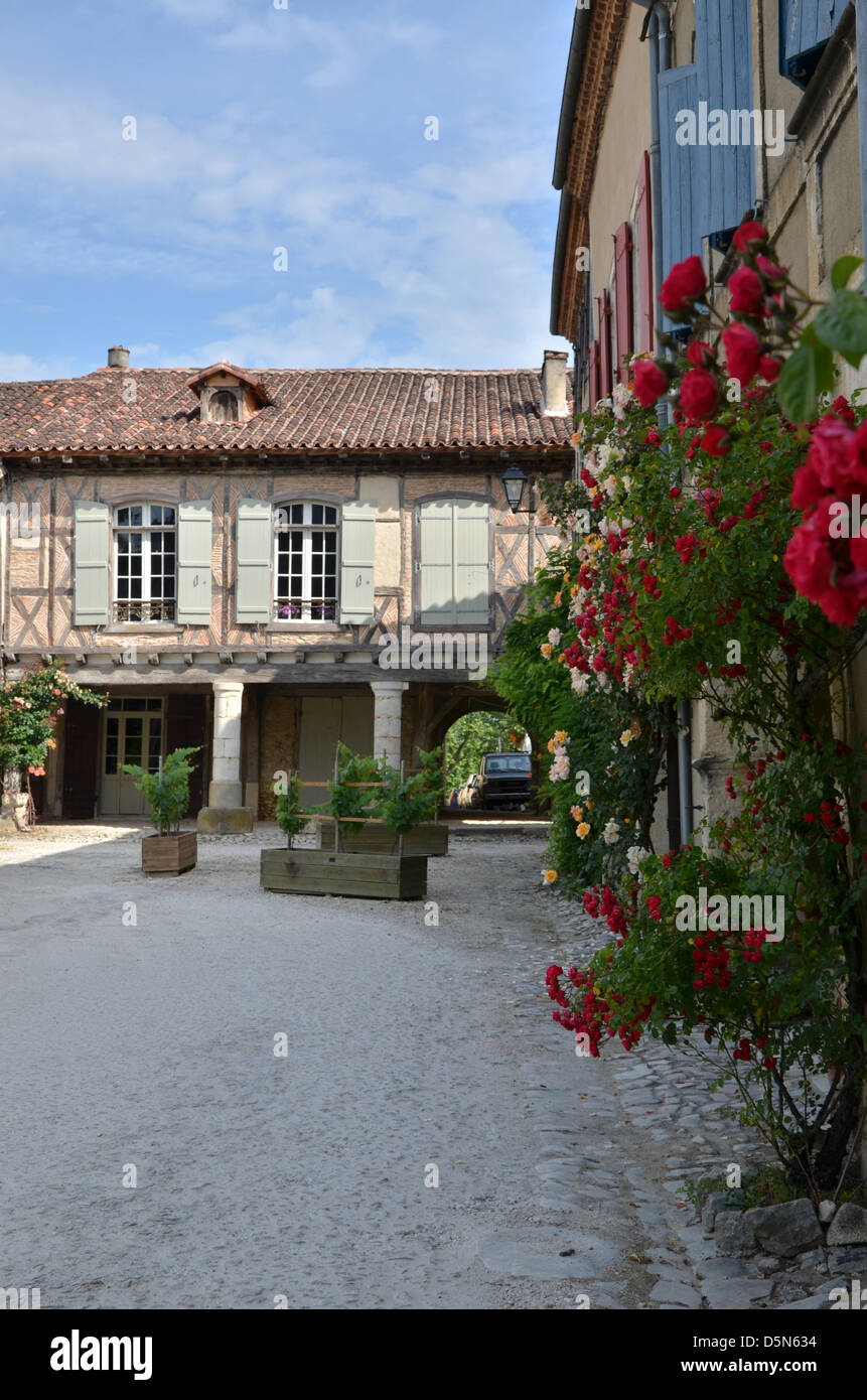 Small houses surround the marketplace of medieval bastide village ...