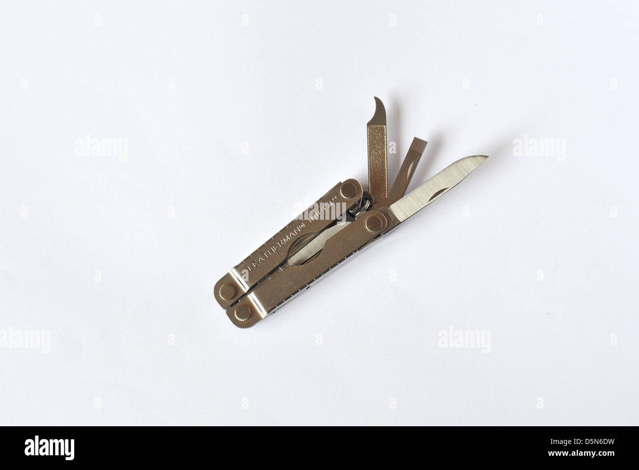 A micro leatherman multi tool photographed in a studio against a white ...