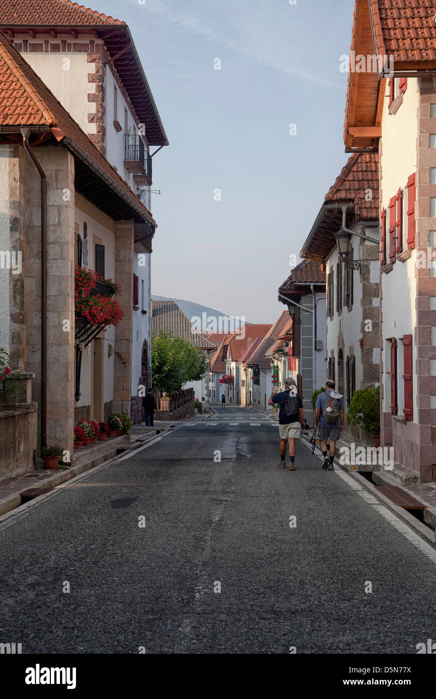 Pilgrims walking through Burguete Spain, on the French Route of the ...