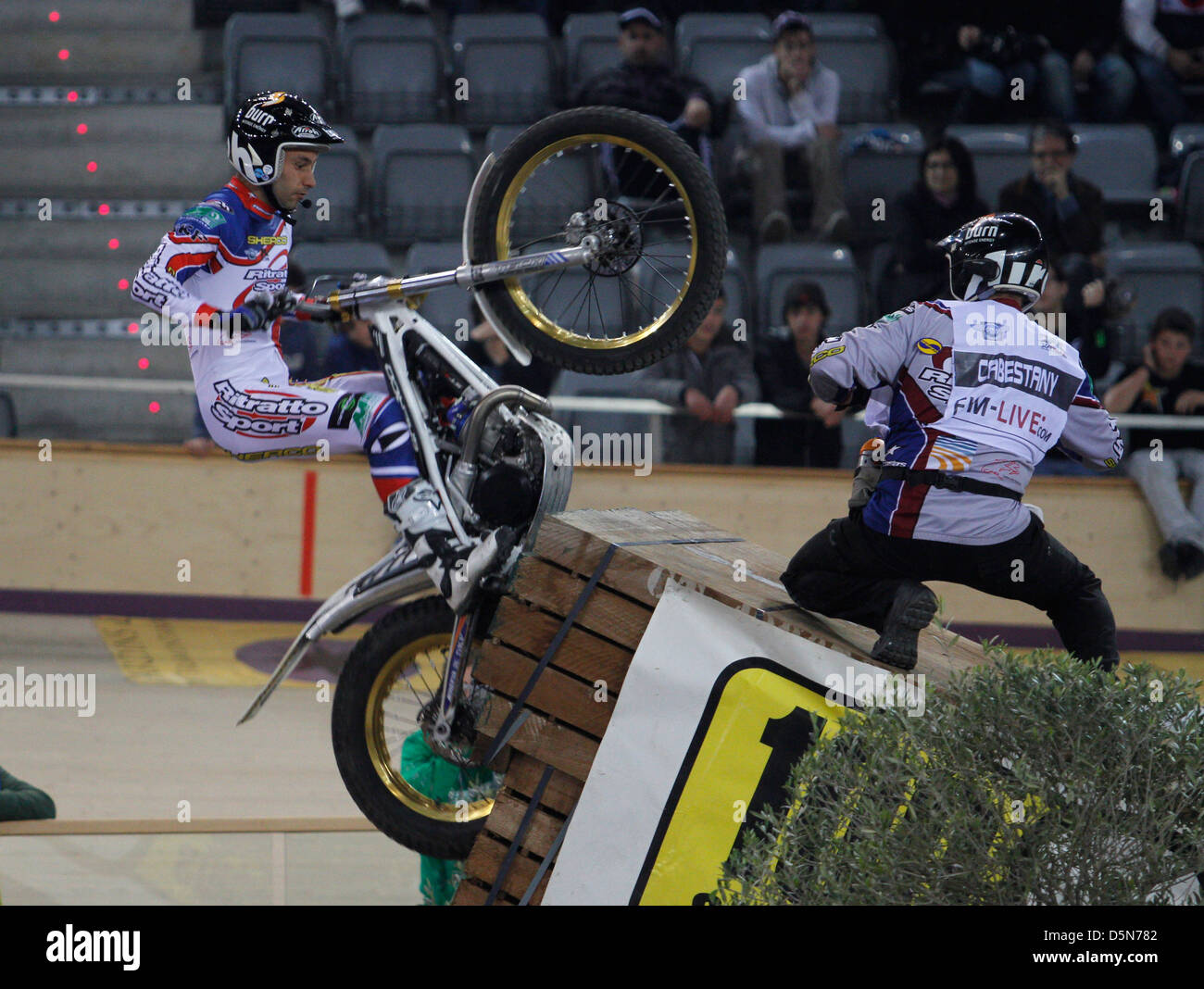 A rider jumps over an obstacle during a stage of the world Trial ...