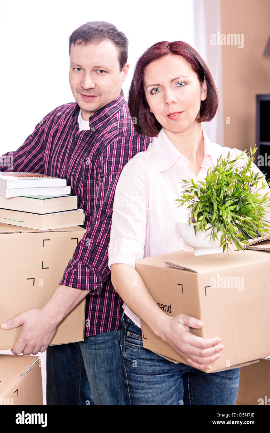 couple by packing for move into a new home Stock Photo - Alamy