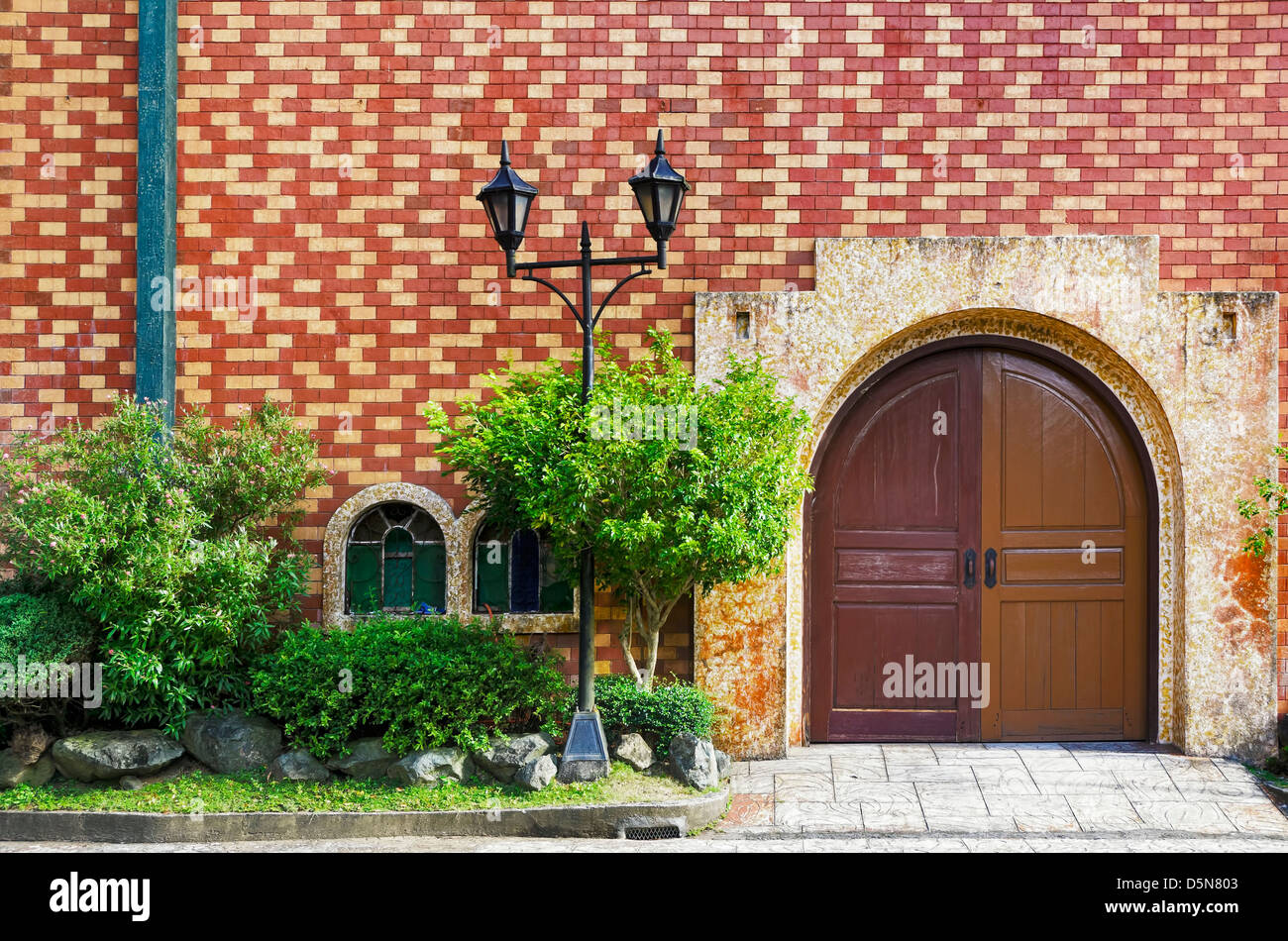 Heavy arch entrance of an ecumenical church Stock Photo - Alamy