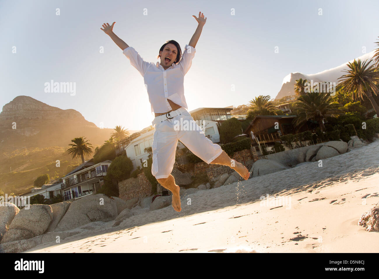 Man Celebrating On Beach Stock Photo - Alamy