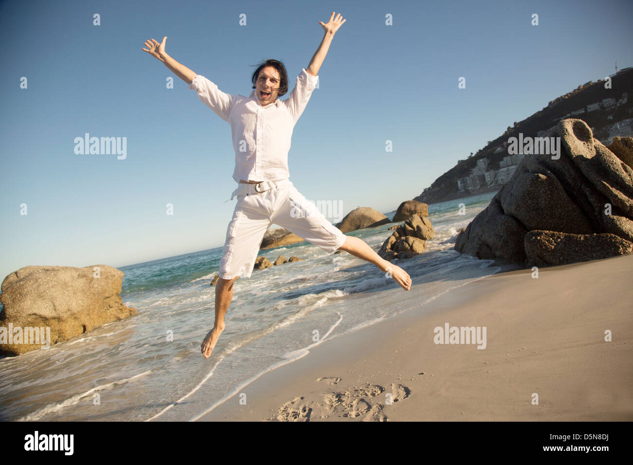 Man Celebrating On Beach Stock Photo - Alamy
