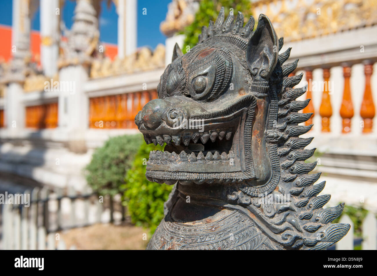 Ornate bronze temple guard outside a Buddhist temple in Thailand Stock ...