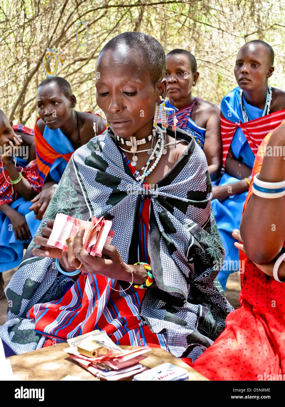 Group of Maasai Women counting money in Tanzania in East Africa;Africa ...