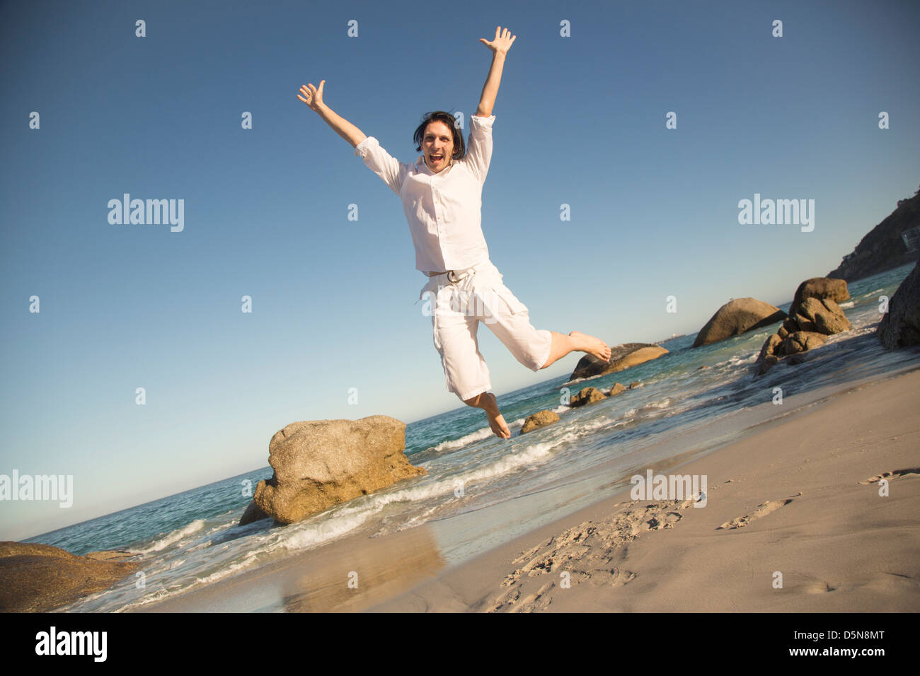 Man Celebrating On Beach Stock Photo - Alamy