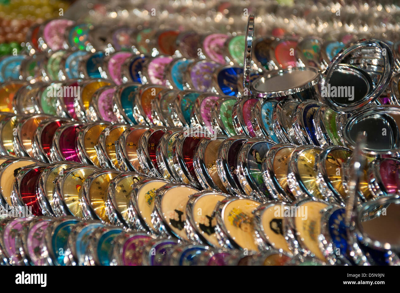 Decorative compact mirrors on a Chinese market stall Stock Photo - Alamy
