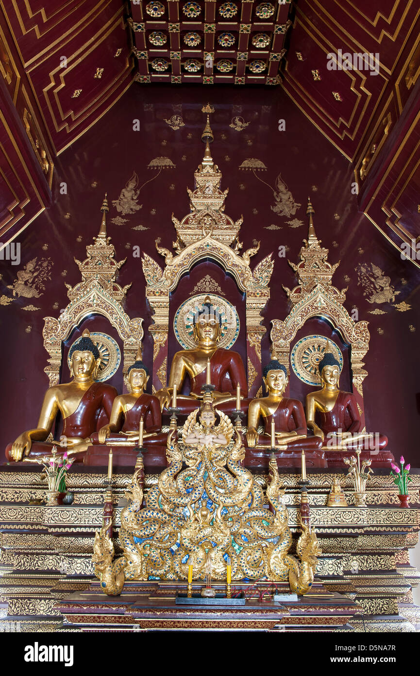 Inside of a Thai Buddhist temple with gold ornate figures Stock Photo ...