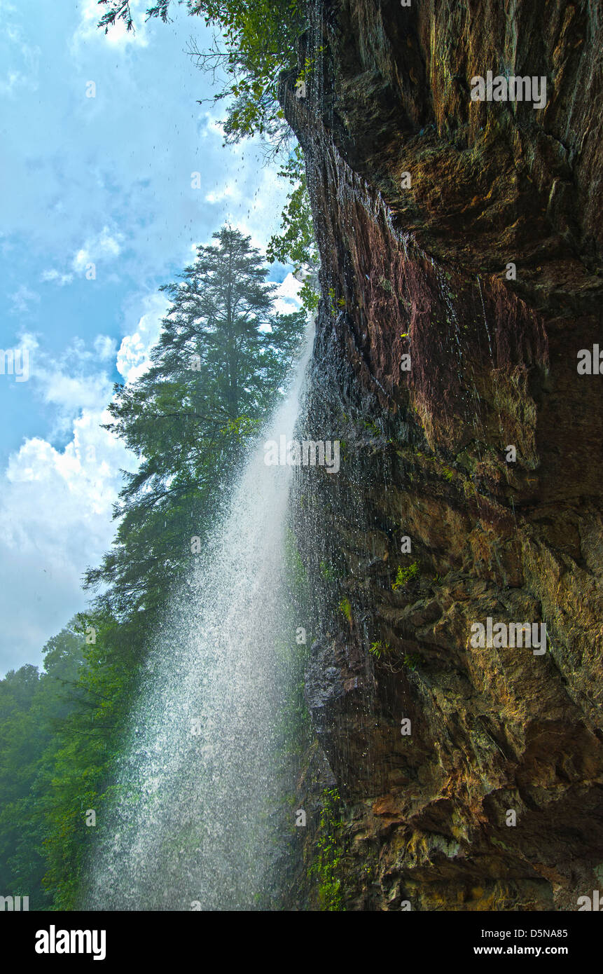 Waterfall with sky from below Stock Photo - Alamy