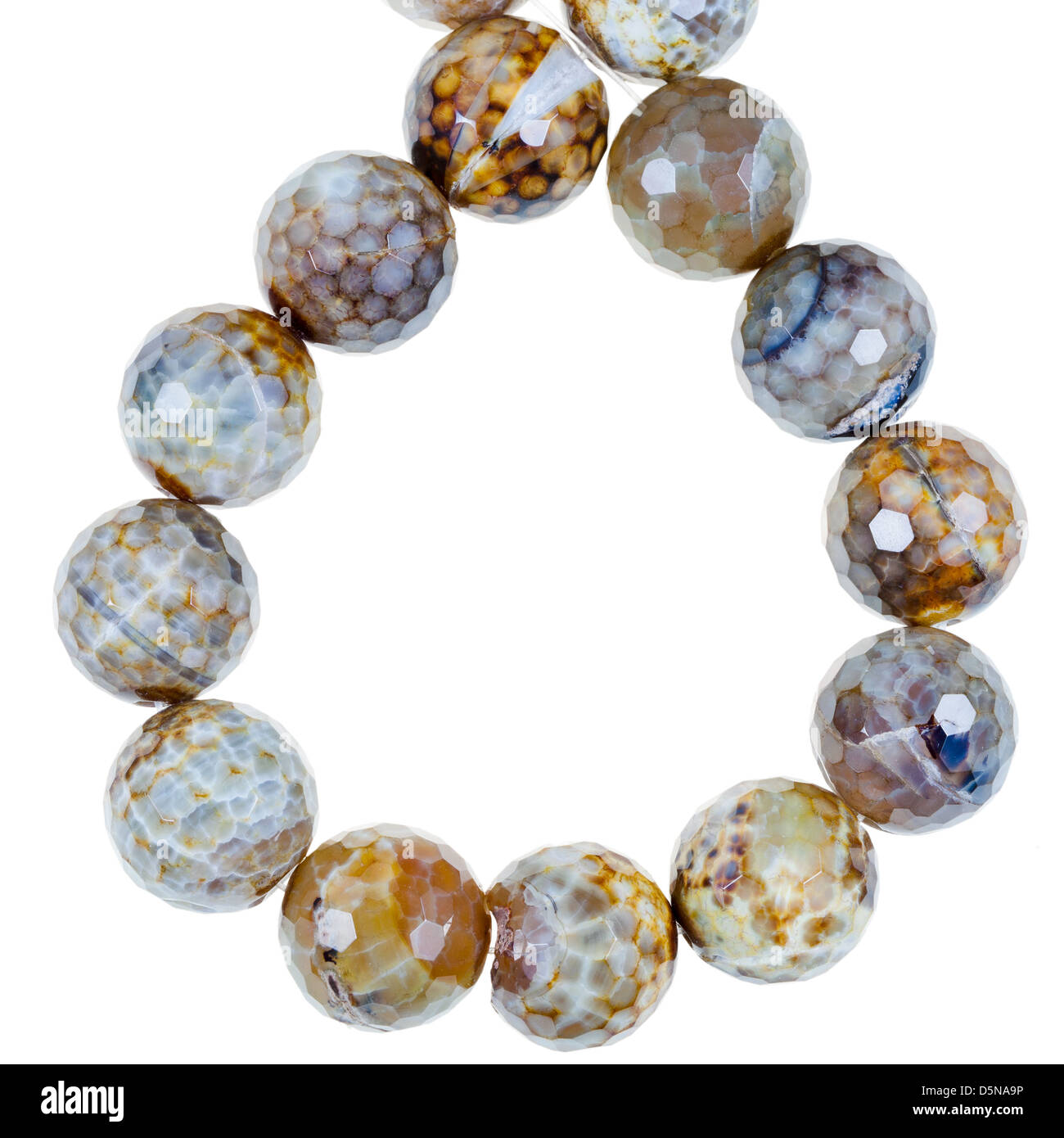 string of round stone beads isolated on white background Stock Photo ...