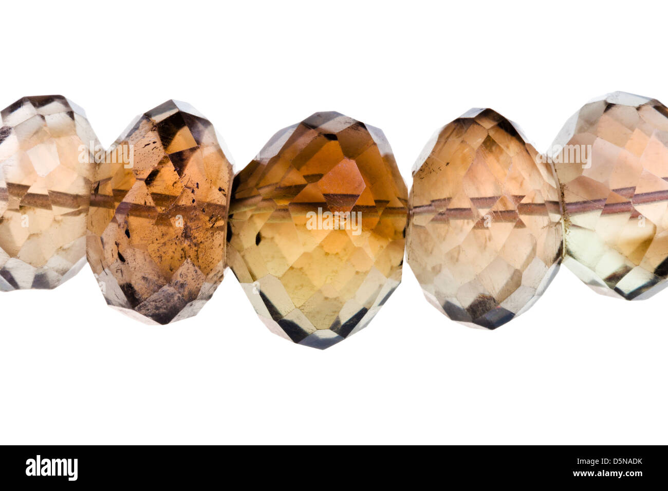 string of smoky quartz beads close up isolated on white background ...